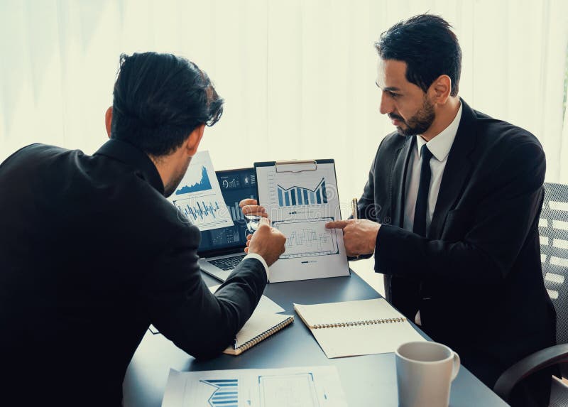 Busy Analyst Team Discussing Financial Data on Laptop. Fervent Stock ...
