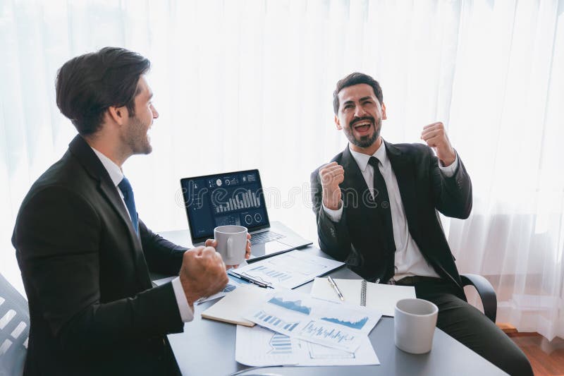 Busy Analyst Team Discussing Financial Data on Laptop. Fervent Stock ...