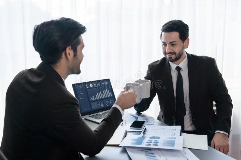 Busy Analyst Team Discussing Financial Data on Laptop. Fervent Stock ...