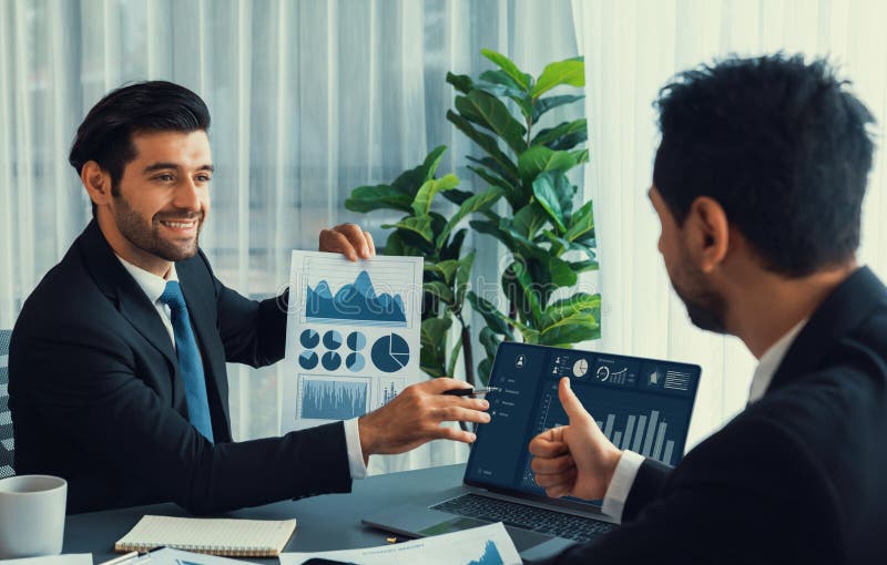 Busy Analyst Team Discussing Financial Data on Laptop. Fervent Stock ...