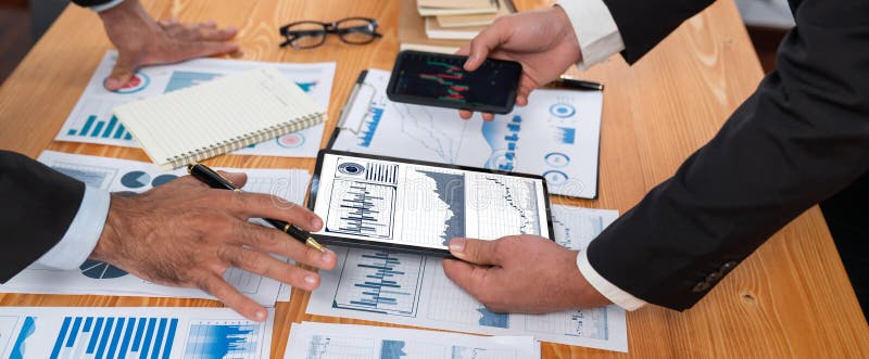 Busy Analyst Team Discussing Financial Data on Tablet. Fervent Stock ...