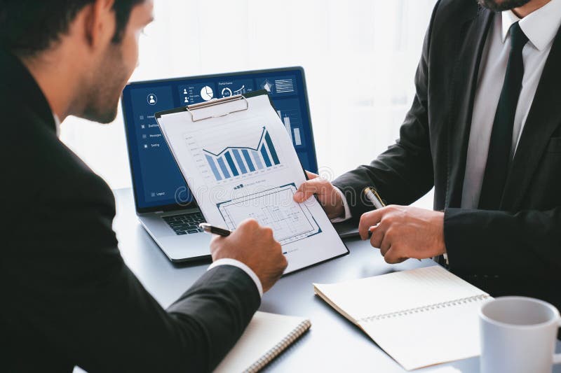 Busy Analyst Team Discussing Financial Data on Laptop. Fervent Stock ... Busy Analyst Team Discussing Financial Data on Laptop. Fervent Stock ...