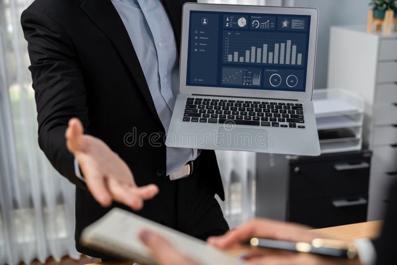 Busy Analyst Team Discussing Financial Data on Laptop. Fervent Stock ...