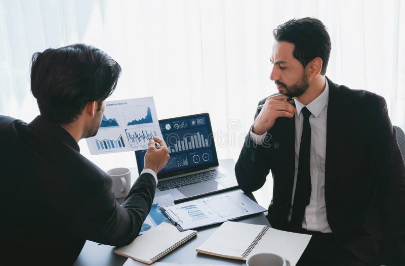 Busy Analyst Team Discussing Financial Data on Laptop. Fervent Stock ...