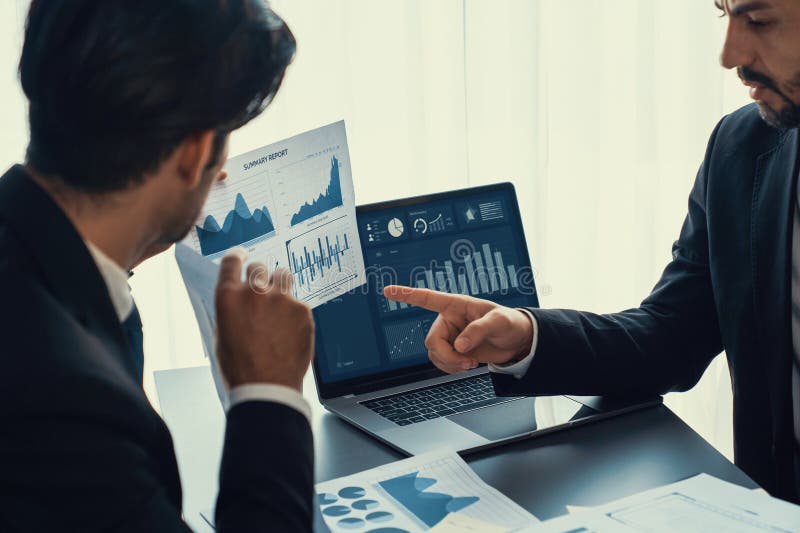 Busy Analyst Team Discussing Financial Data on Laptop. Fervent Stock ...