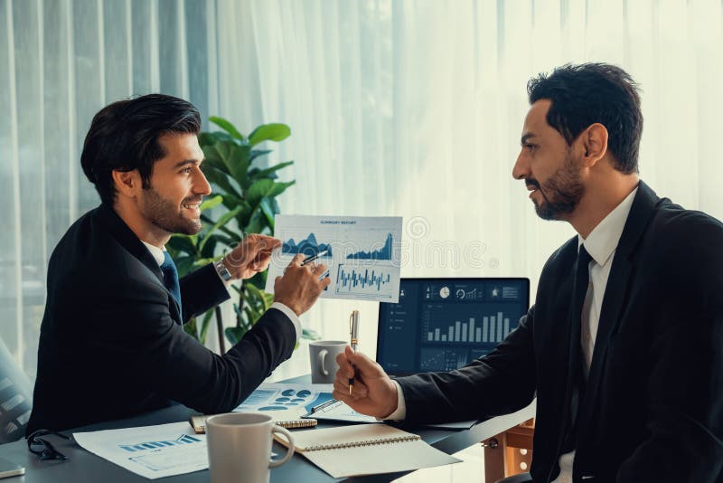 Busy Analyst Team Discussing Financial Data on Laptop. Fervent Stock ...