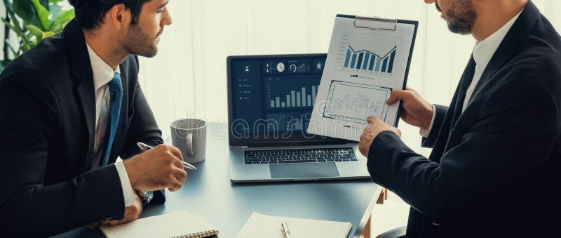 Busy Analyst Team Discussing Financial Data on Laptop. Fervent Stock ...