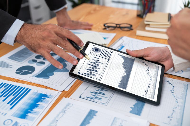 Busy Analyst Team Discussing Financial Data on Tablet. Fervent Stock ... Busy Analyst Team Discussing Financial Data on Tablet. Fervent Stock ...