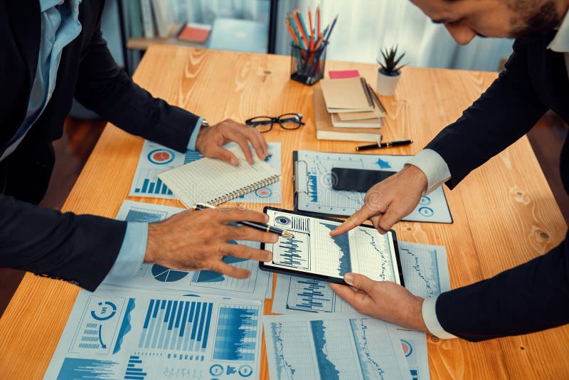 Busy Analyst Team Discussing Financial Data on Tablet. Fervent Stock ... Busy Analyst Team Discussing Financial Data on Tablet. Fervent Stock ...