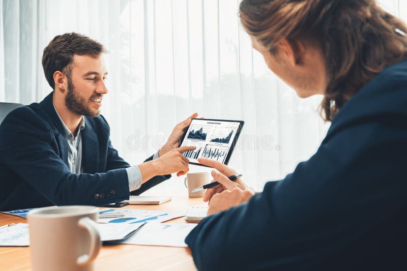 Busy Analyst Team in Office Analyzing Financial Data Analysis by Tablet ...