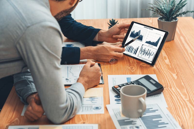 Busy Analyst Team in Office Analyzing Financial Data Analysis by Tablet ...