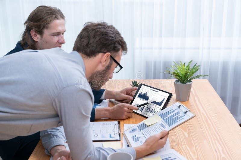 Busy Analyst Team in Office Analyzing Financial Data Analysis by Tablet ...