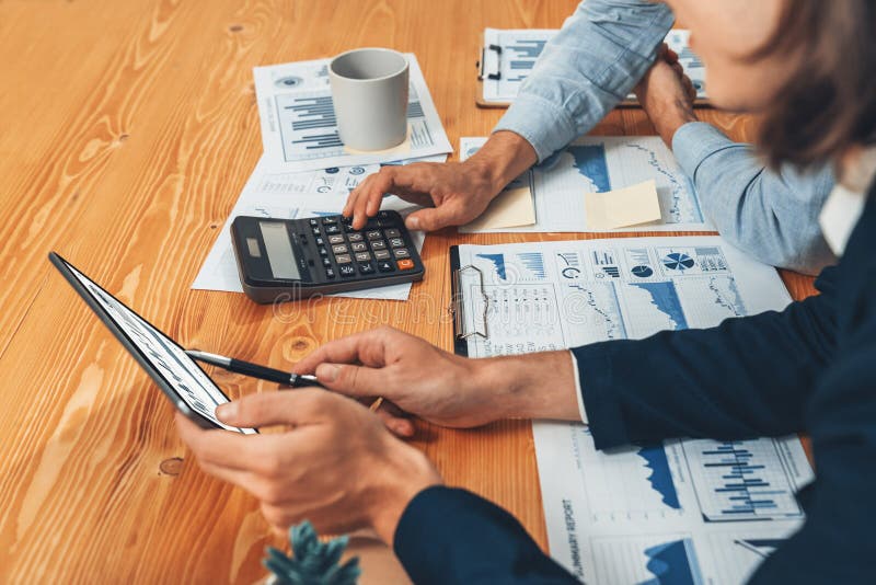 Busy Analyst Team in Office Analyzing Financial Data Analysis by Tablet ...