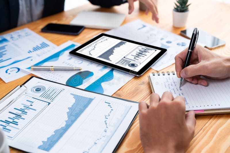 Busy Analyst Team in Office Analyzing Financial Data Analysis by Tablet ...