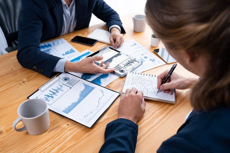 Busy Analyst Team in Office Analyzing Financial Data Analysis by Tablet ...