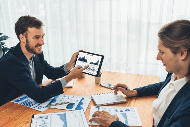 Busy Analyst Team in Office Analyzing Financial Data Analysis by Tablet ...