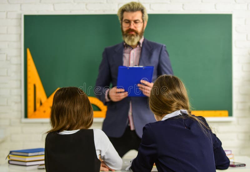 Really Busy. Back To School. Teacher and Pupils Working at Desk ...