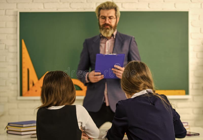 Really Busy. Back To School. Teacher and Pupils Working at Desk ...
