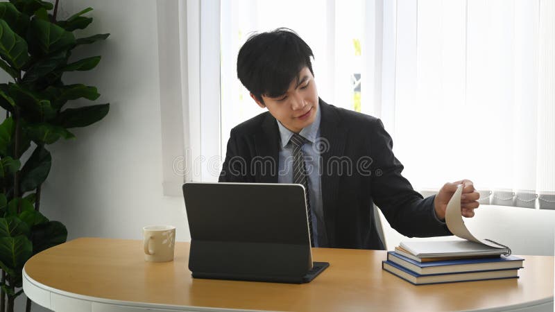 Busy Businessman Working with Computer Tablet and Looking Information ...