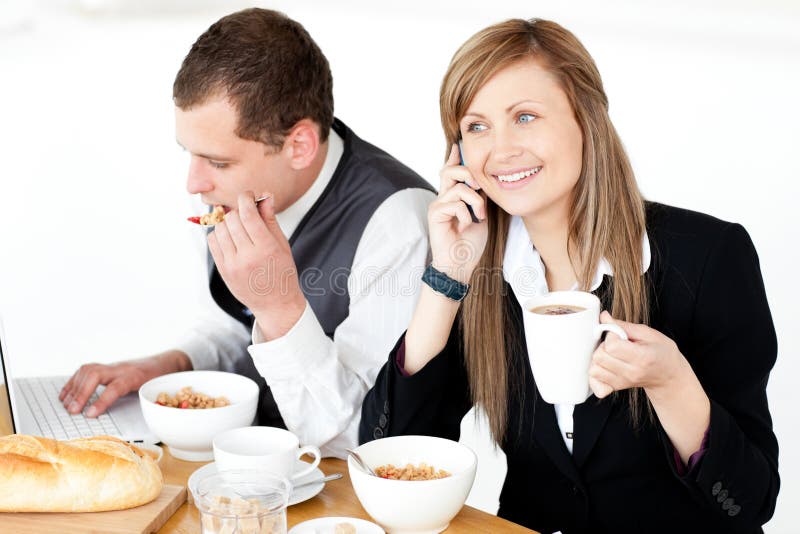 Busy Businesspeople Working during Breakfast Stock Photo - Image of ...