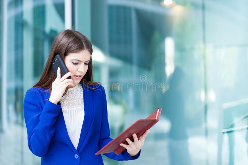 The Busy Businesswoman is Talking on the Phone during a Break Stock ...