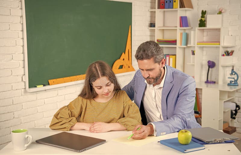 Busy Child Study in Classroom with Tutor Stock Image - Image of help ...