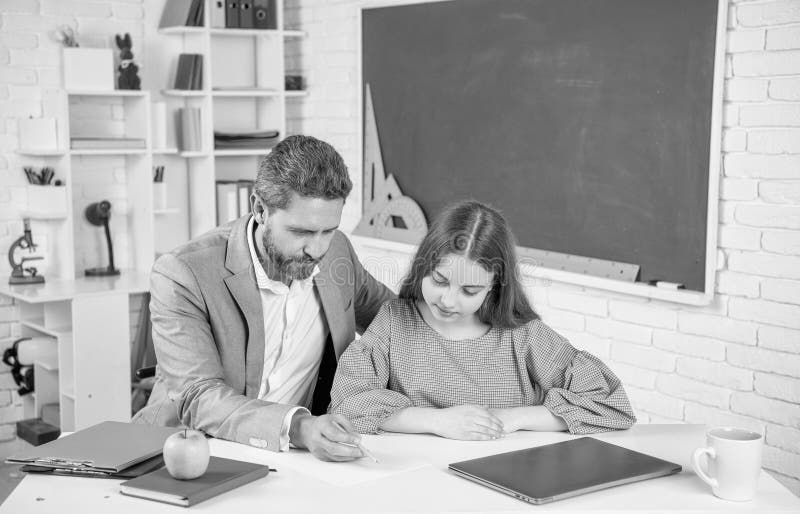 Busy Child Study in Classroom with Tutor Stock Photo - Image of ...