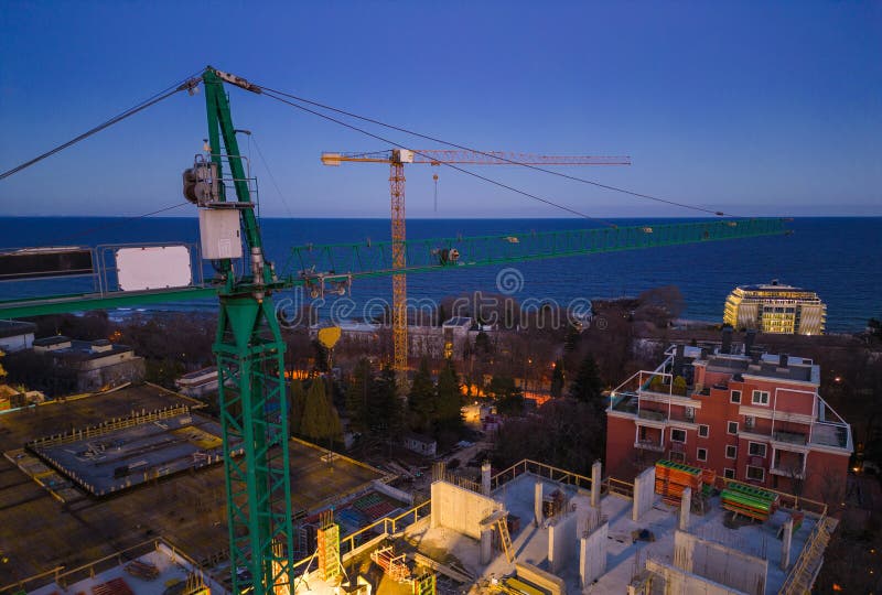 Busy Construction Site and Construction Equipment at Night. Aerial View ...