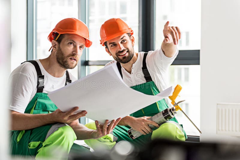 Busy Constructors Discussing Plan for Work Stock Image - Image of adult ...