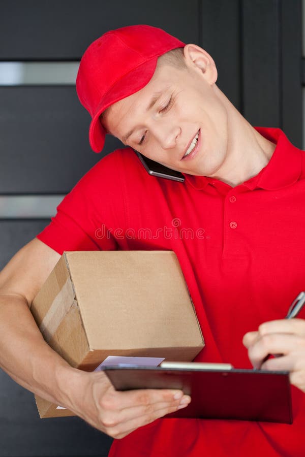 Busy Courier Calling on Mobile Phone Stock Photo - Image of house ...