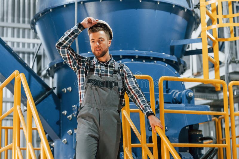 Busy Day. Construction Worker in Uniform is in the Factory Stock Photo ...