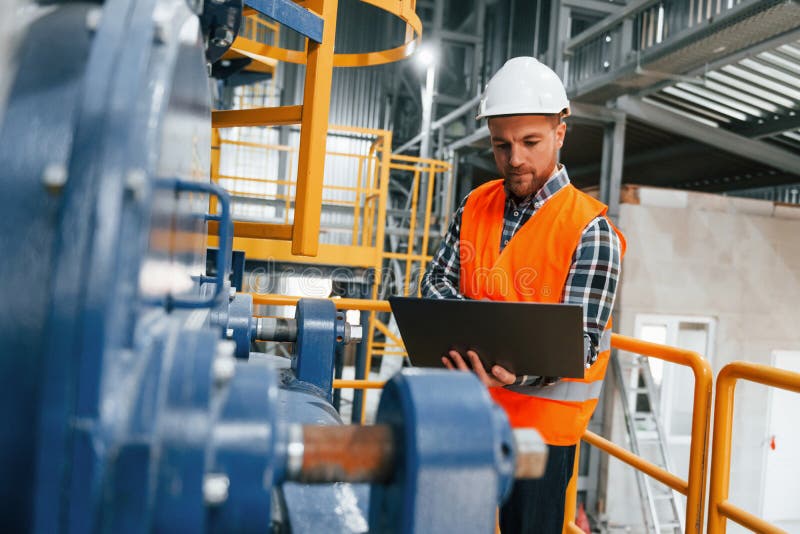 Busy Day. Construction Worker in Uniform is in the Factory Stock Image ...