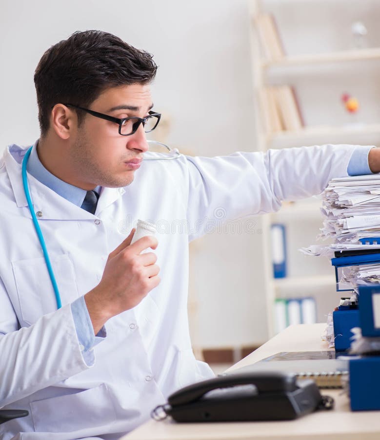 Busy Doctor with Too Much Work in Hospital Stock Photo - Image of ...