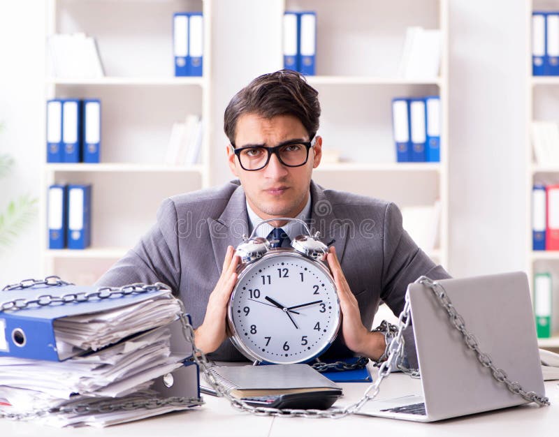 Busy Employee Chained To His Office Desk Stock Photo - Image of ...