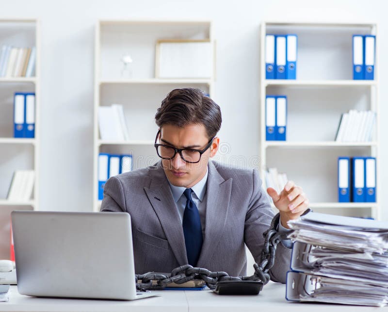 Busy Employee Chained To His Office Desk Stock Photo - Image of ...