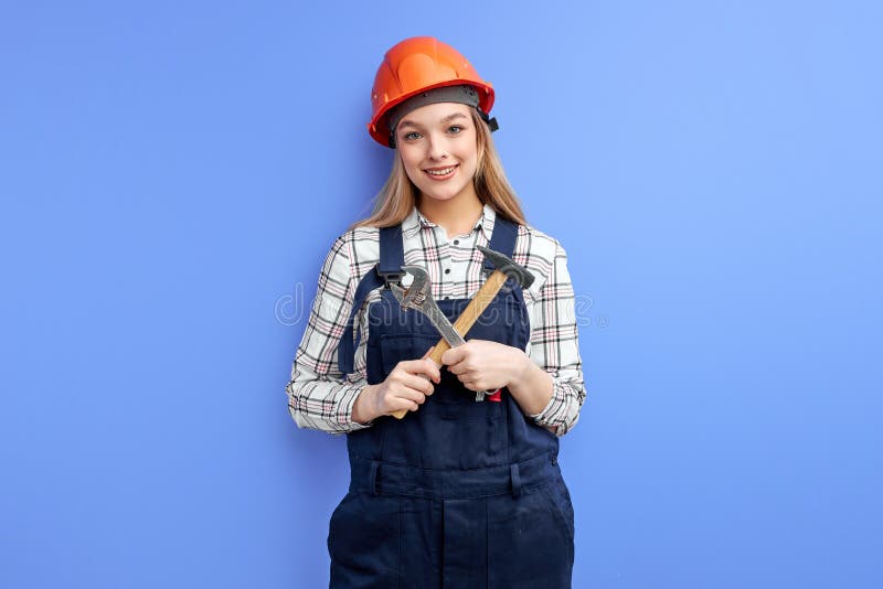 Cheerful Young Engineer Constructor Woman Looking at Camera Holding ...