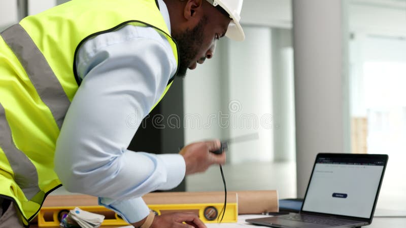 Busy Engineer Talking and Working on Project Management while Looking ...