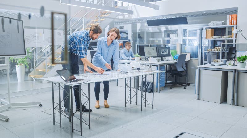 In the Busy Engineering Facility: Diverse Group of Engineers ...