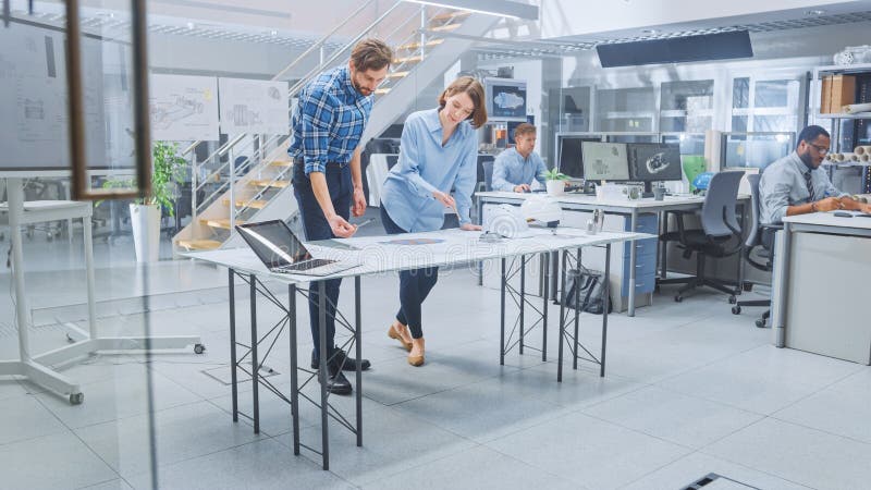 In the Busy Engineering Facility: Diverse Group of Engineers ...