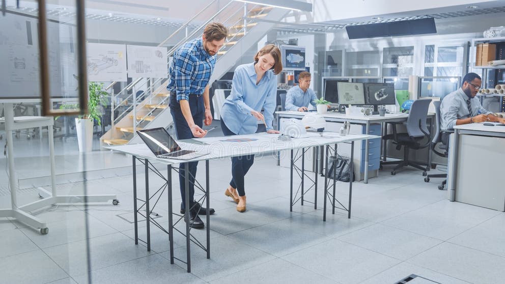 In the Busy Engineering Facility: Diverse Group of Engineers ...