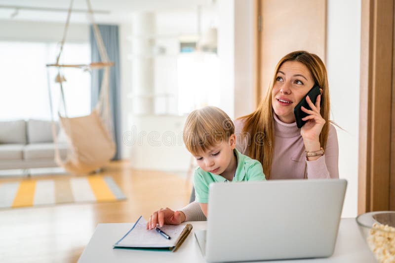 Busy Family Mother and Child at Home Working on the Computer Stock ...