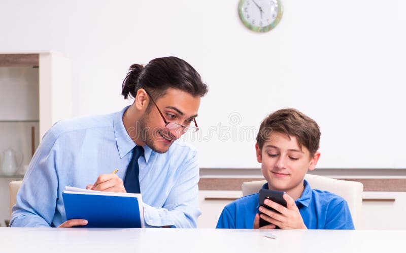 Busy Father Helping His Son To Prepare for Exam Stock Photo - Image of ...