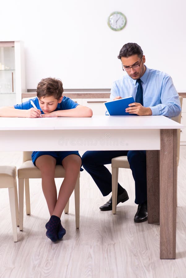 Busy Father Helping His Son To Prepare for Exam Stock Photo - Image of ... Busy Father Helping His Son To Prepare for Exam Stock Photo - Image of ...