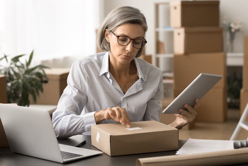 Busy Grey Haired E-commerce Business Owner Woman Checking Barcode Stock ...