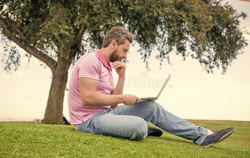 Busy Guy Check Email on Computer Relaxing on Grass, Online Education ...