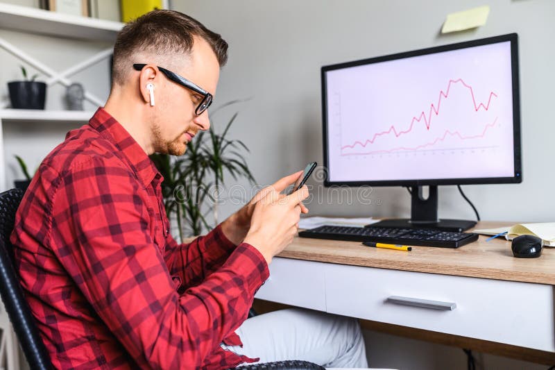 Busy Handsome Guy Works at the Office Using Phone Stock Image - Image ...
