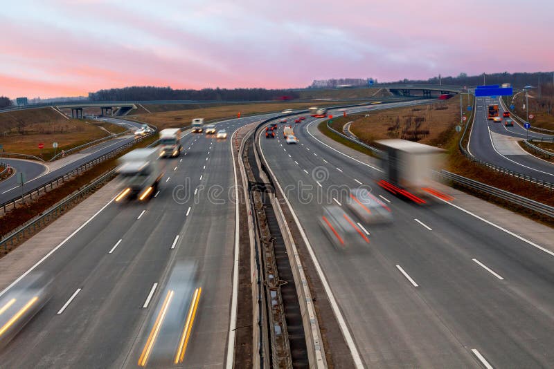Busy Highway with Fast Moving Vehicles in Beautiful Sunset Stock Image ...