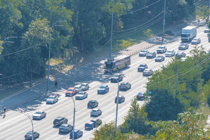 A Busy Highway Scene during Daytime from an Elevated Viewpoint Shows ...