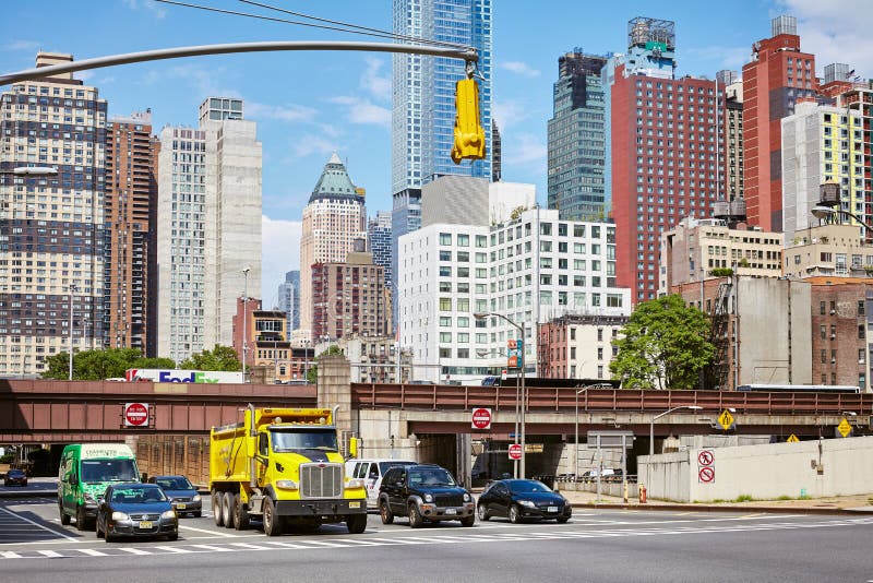 Busy Intersection in Downtown New York with Modern Skyline in ...