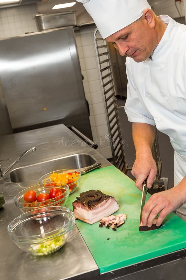 Busy Male Cook Cutting Meat in Kitchen Stock Photo - Image of male ...